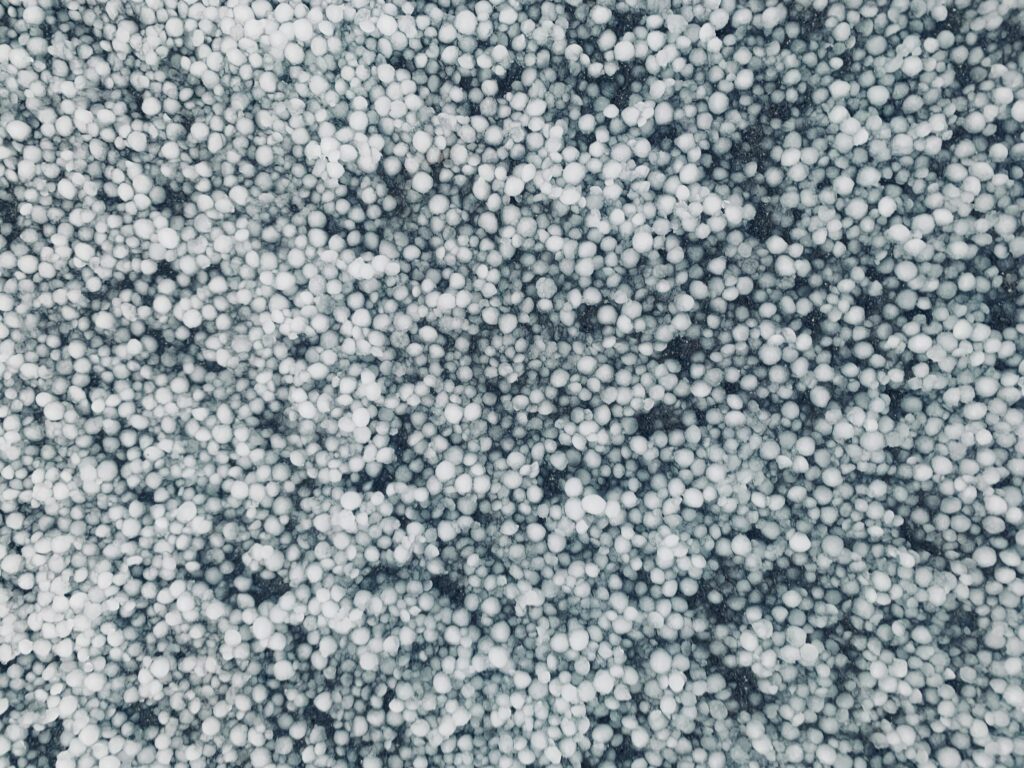 Heavy equipment, snow shovels used to clean up hail piled knee-deep in Yuma